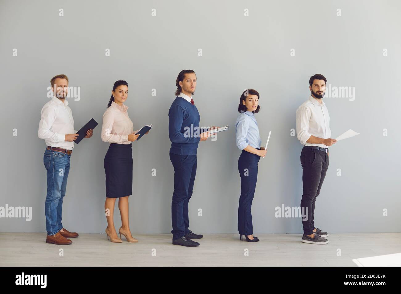 Job applicants lining hi-res stock photography and images - Alamy