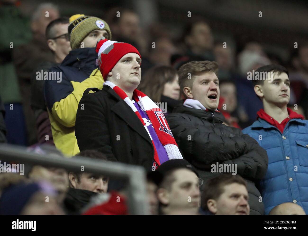Stoke City fans in the stands Stock Photo - Alamy