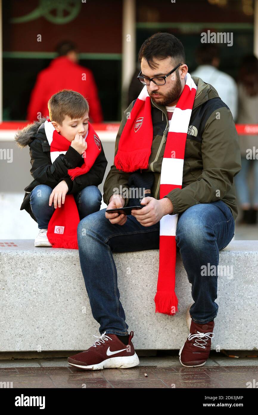 Arsenal fans arrive outside of the Emirates Stadium ahead of the match ...