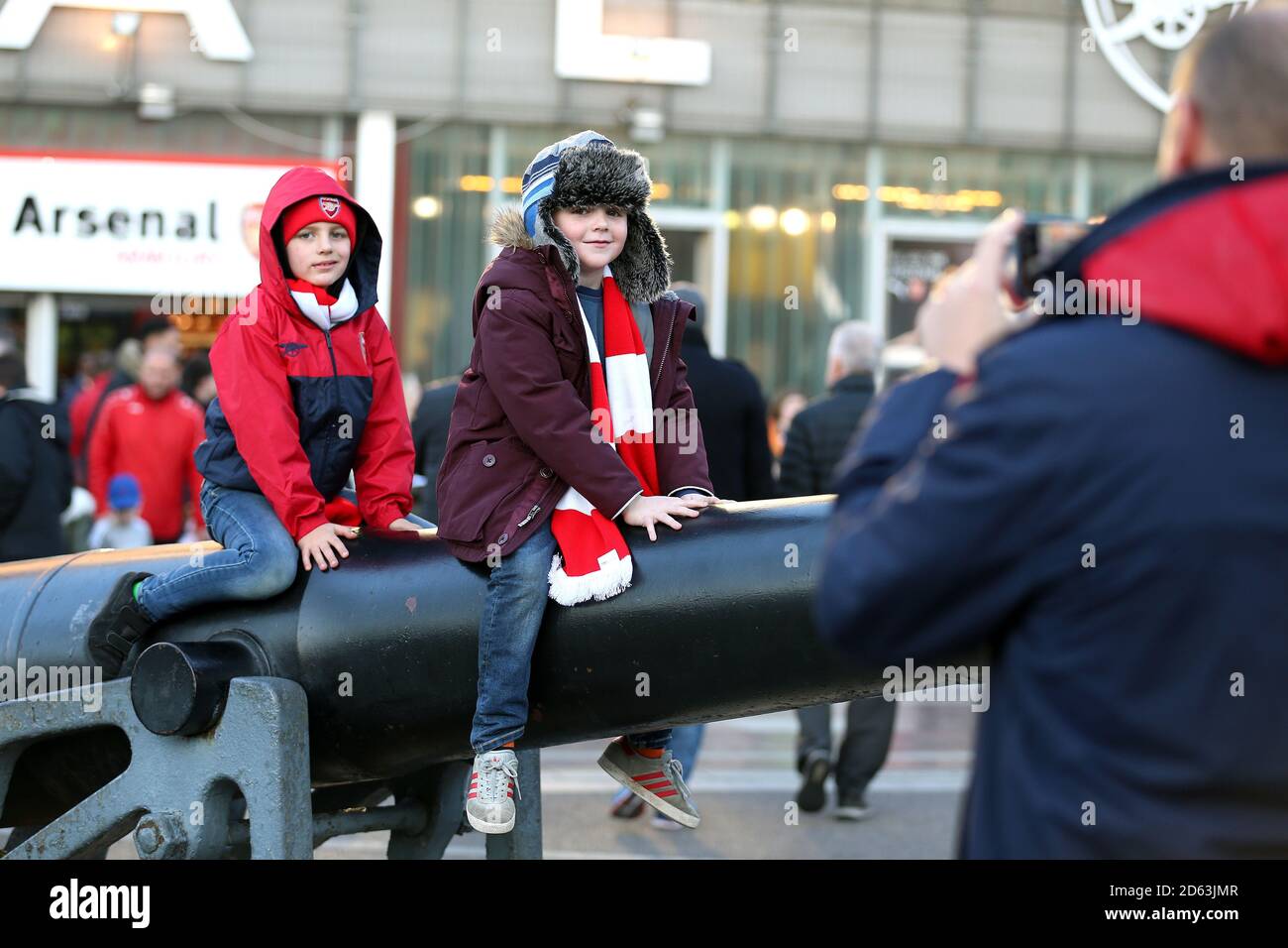 Arsenal fans pose for a photograph outside of the Emirates Stadium ...