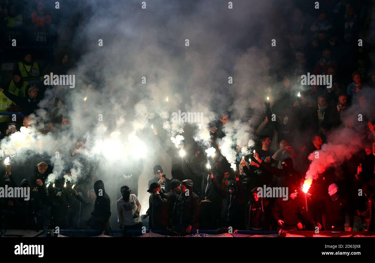 Malmo fans let off flairs during the game Stock Photo - Alamy