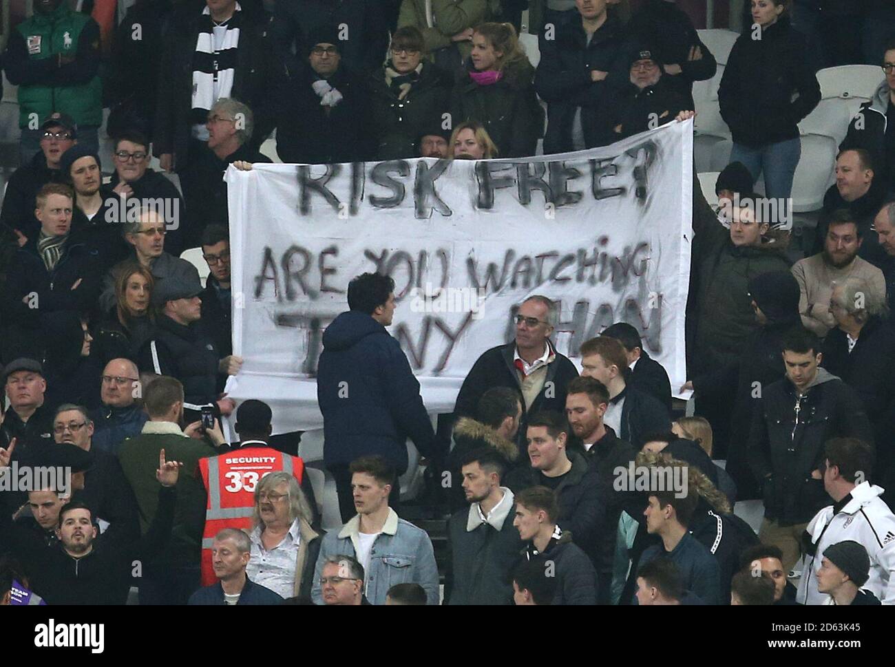 Fulham fans hold up a banner aimed at co-owner Tony Khan in the stands ...