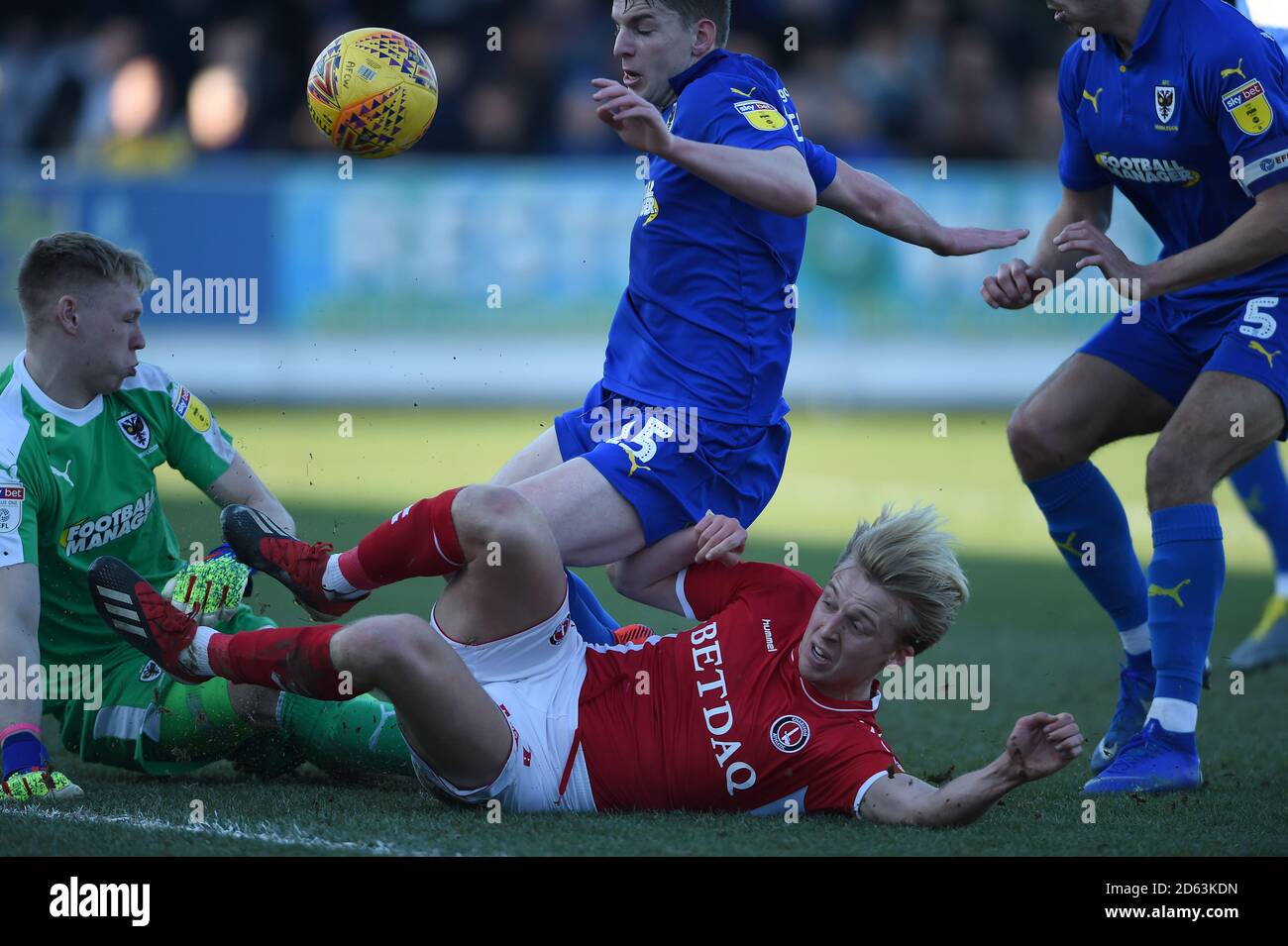 Charlton Athletic's George Lapslie gets his shot away despite the ...