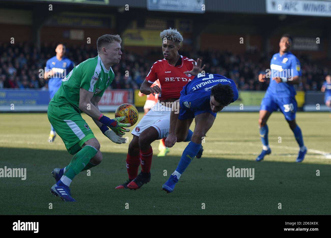 Charlton Athletic's Lyle Taylor (centre) is crowded out by AFC ...