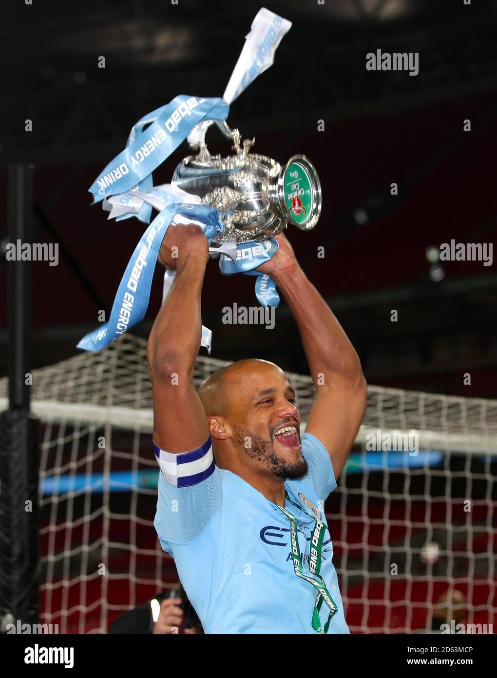 Manchester City's Vincent Kompany celebrates with the trophy after ...