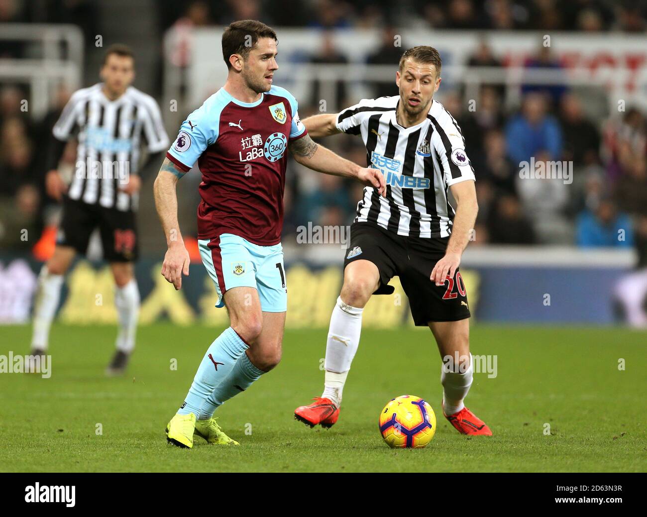 Burnley's Robbie Brady (left) and Newcastle United's Florian Lejeune ...