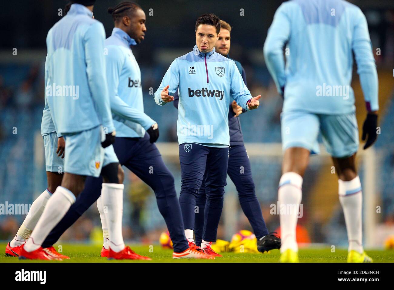 West Ham United's Samir Nasri (centre) gestures with team mates ahead ...