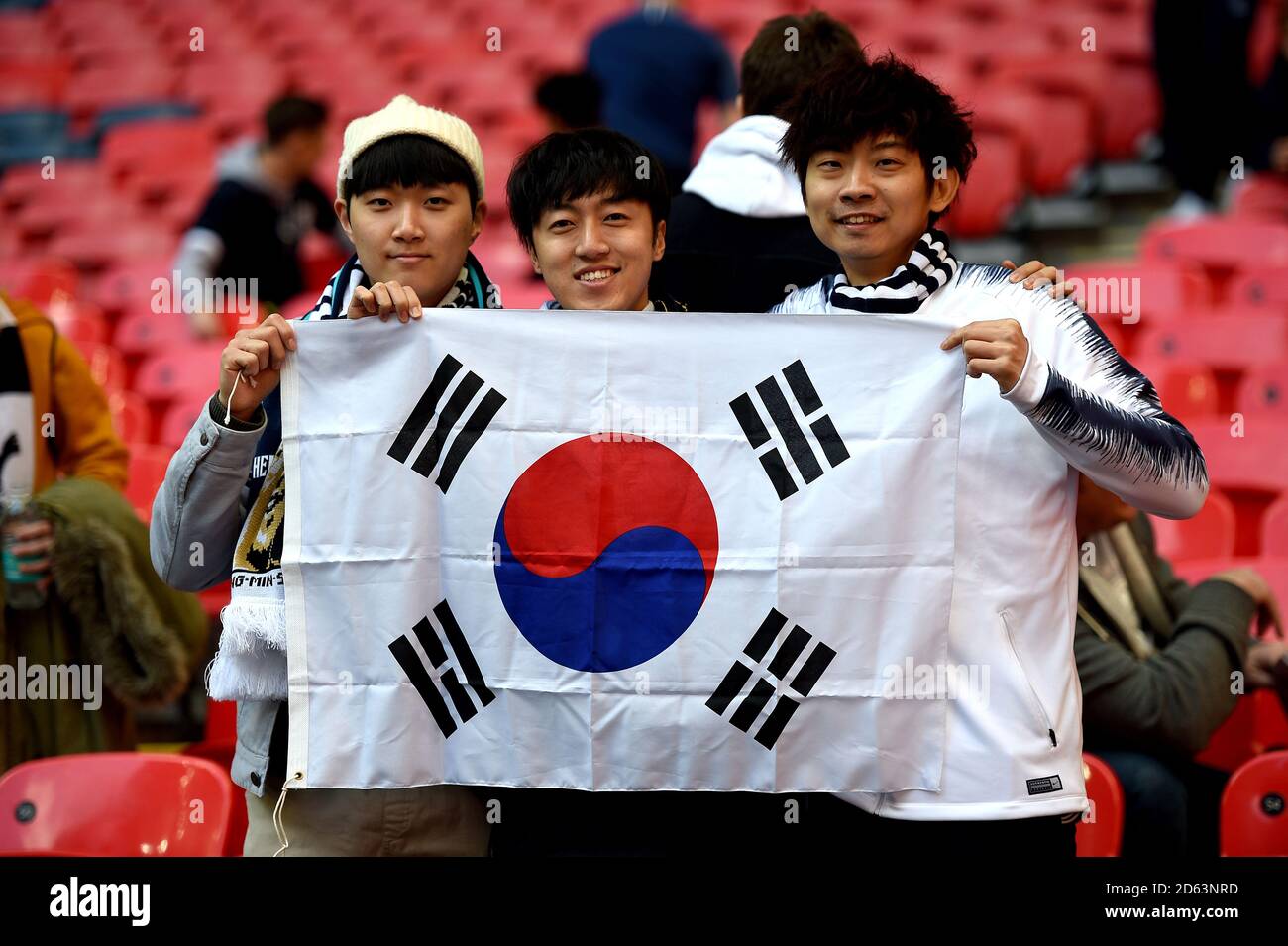 Tottenham Hotspur fans holds up a South Korean flag in the stands Stock ...