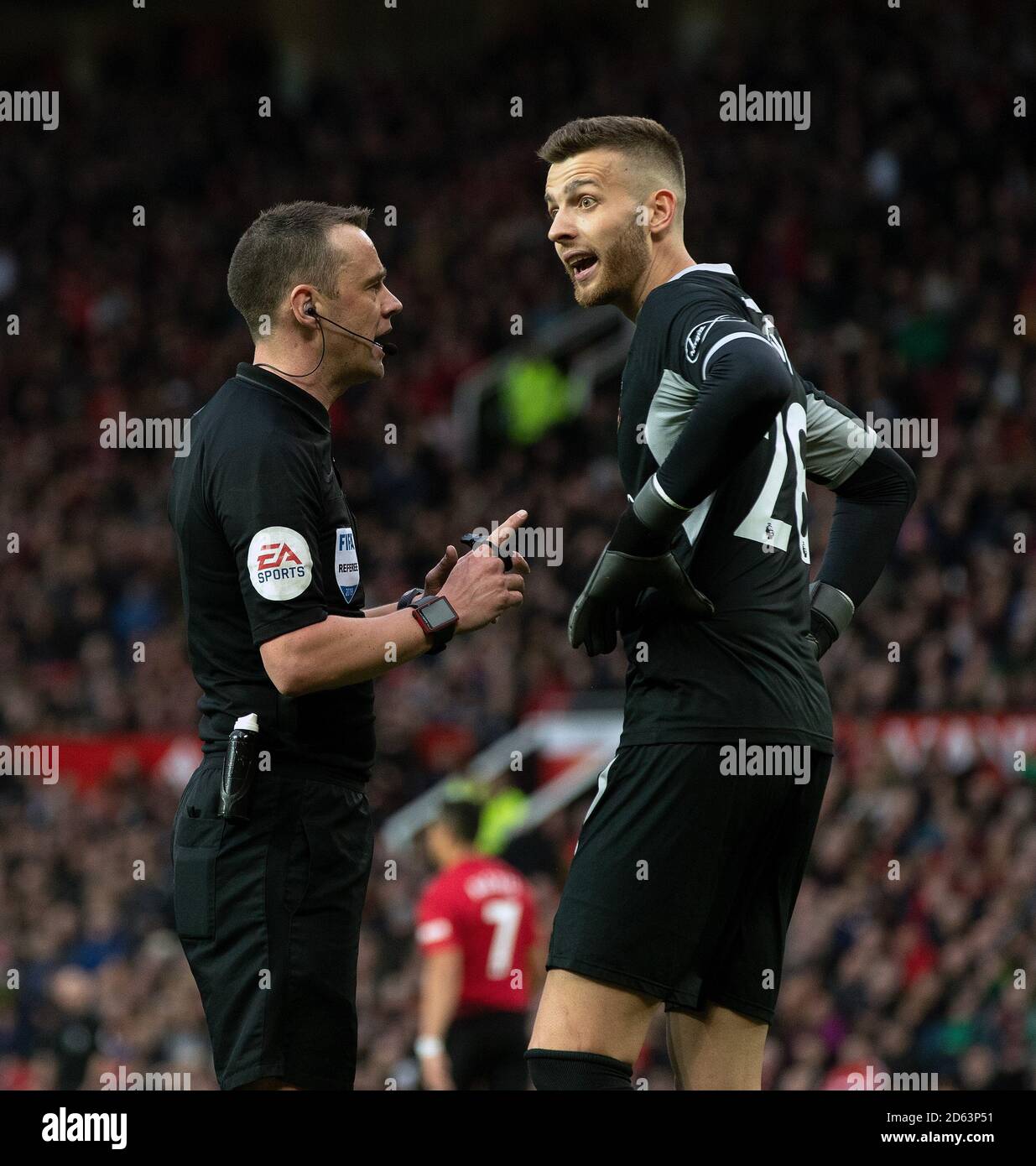 Southampton goalkeeper Angus Gunn (right) is spoke to by referee Stuart ...