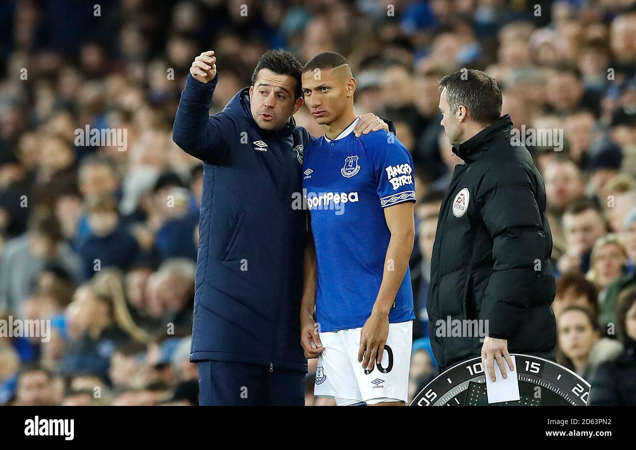 Everton manager Marco Silva speaks to Richarlison on the touchline ...