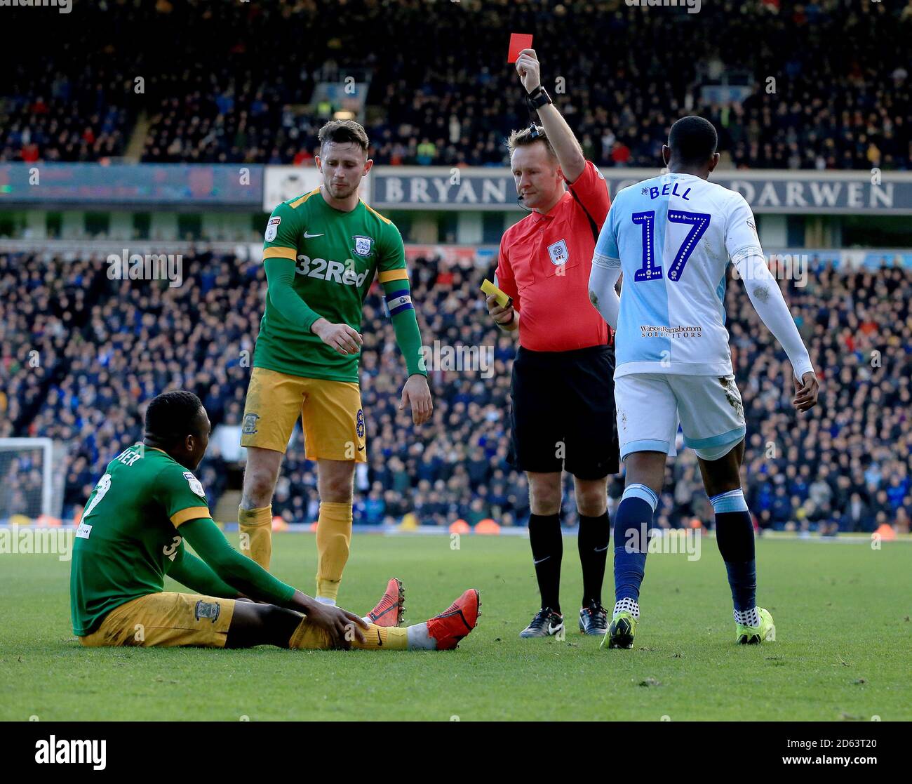 Preston North End's Darnell Fisher (left) is shown a red card by ...