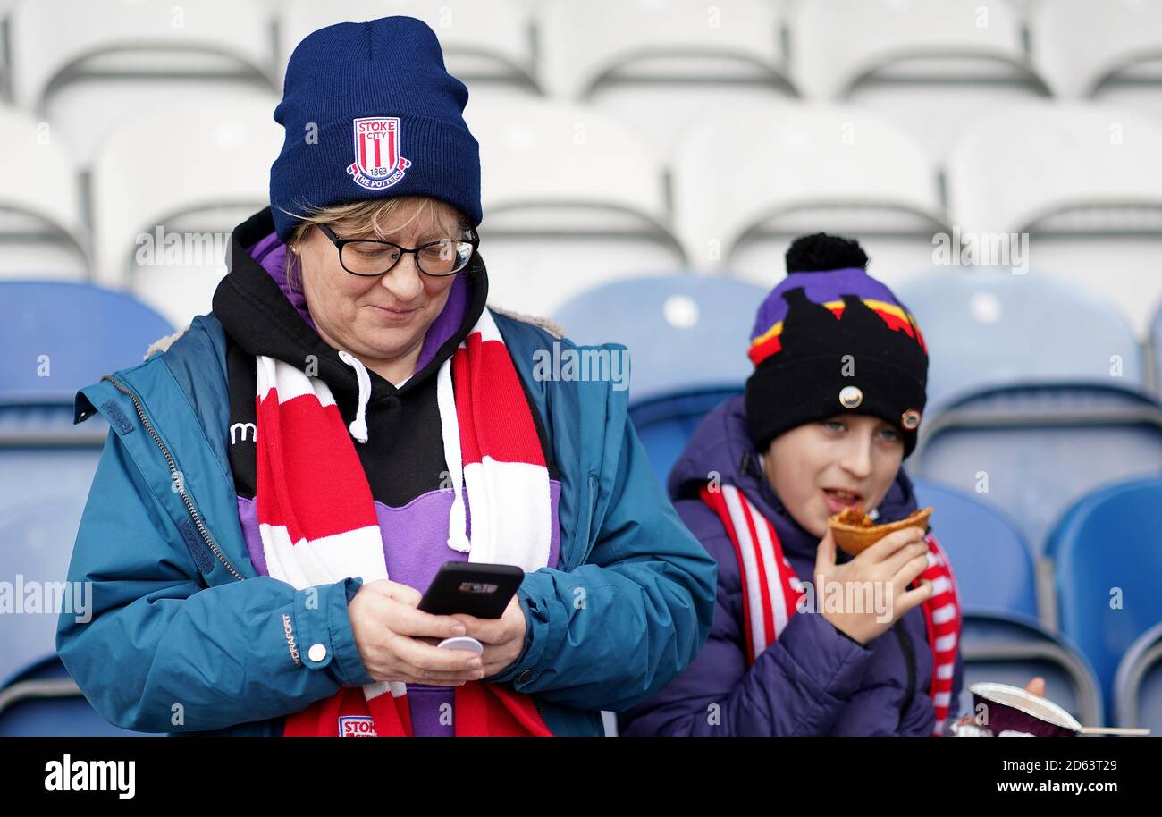 Stoke City fans in the stands Stock Photo - Alamy