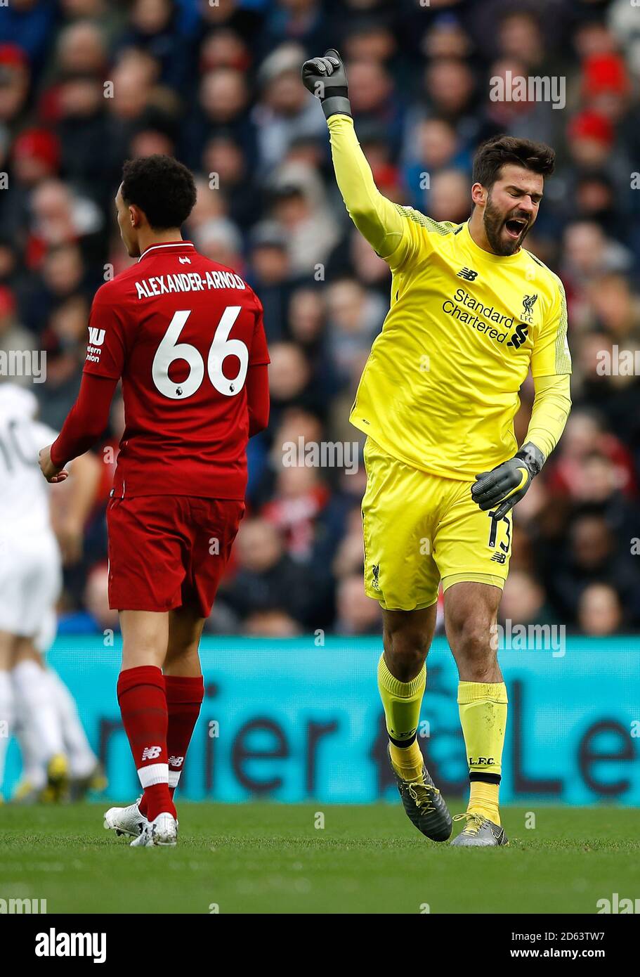 Liverpool goalkeeper Alisson Becker (right) reacts negativity to ...