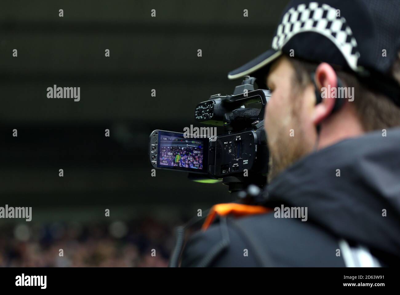 Police using camera equipment during the game Stock Photo - Alamy