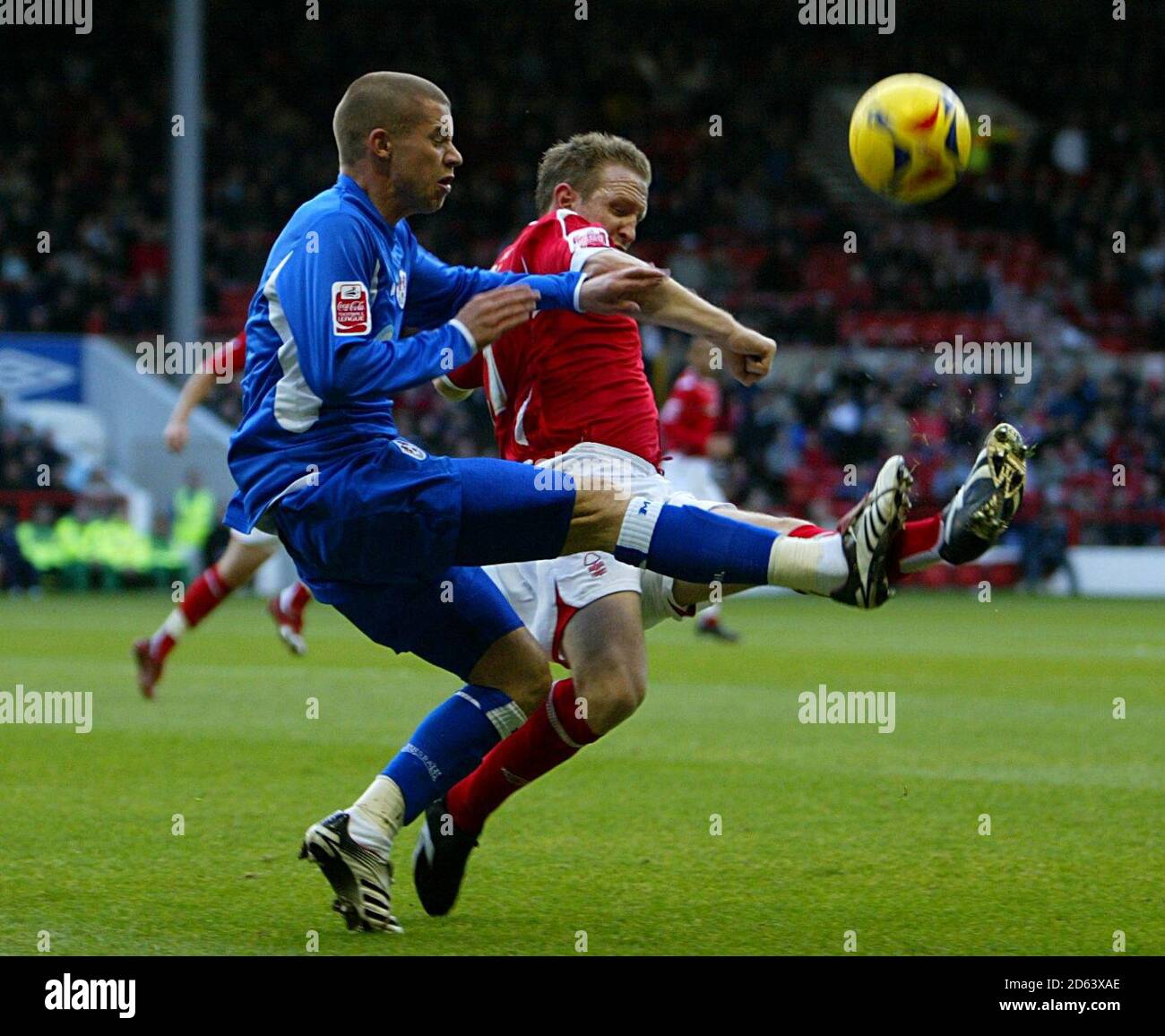 Nottingham Forest's John Curtis and Millwall's Alan Dunne battle for ...