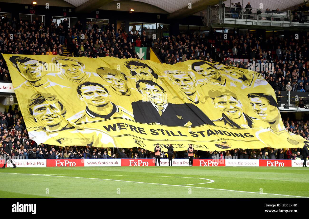 Watford fans show their support by holding a 'We're still standing ...