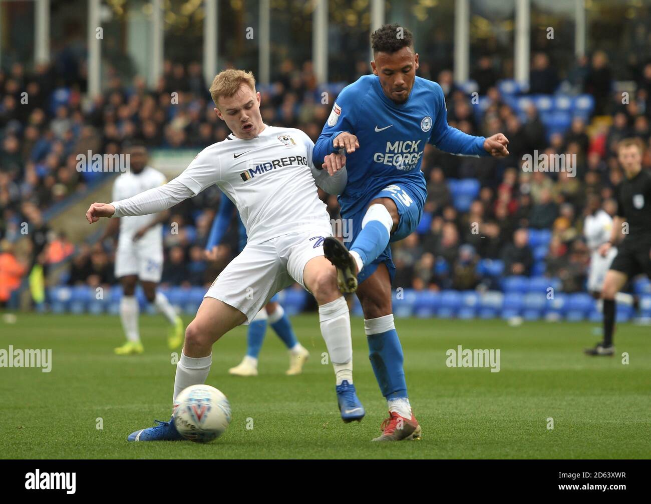 Coventry City's Luke Thomas (left) and Peterborough United's Tyler ...