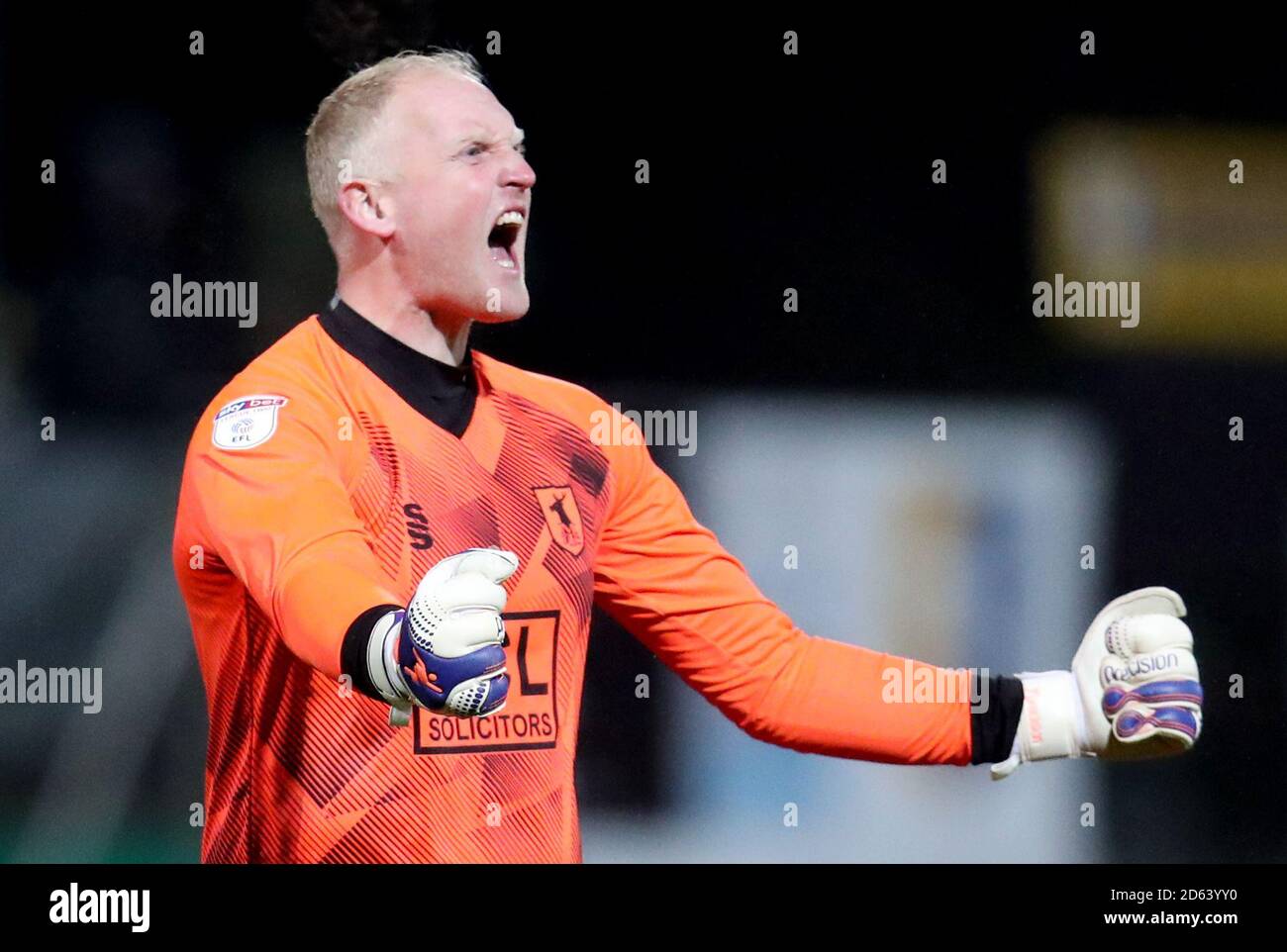 Mansfield Town goalkeeper Conrad Logan celebrates after his team goes 1 ...