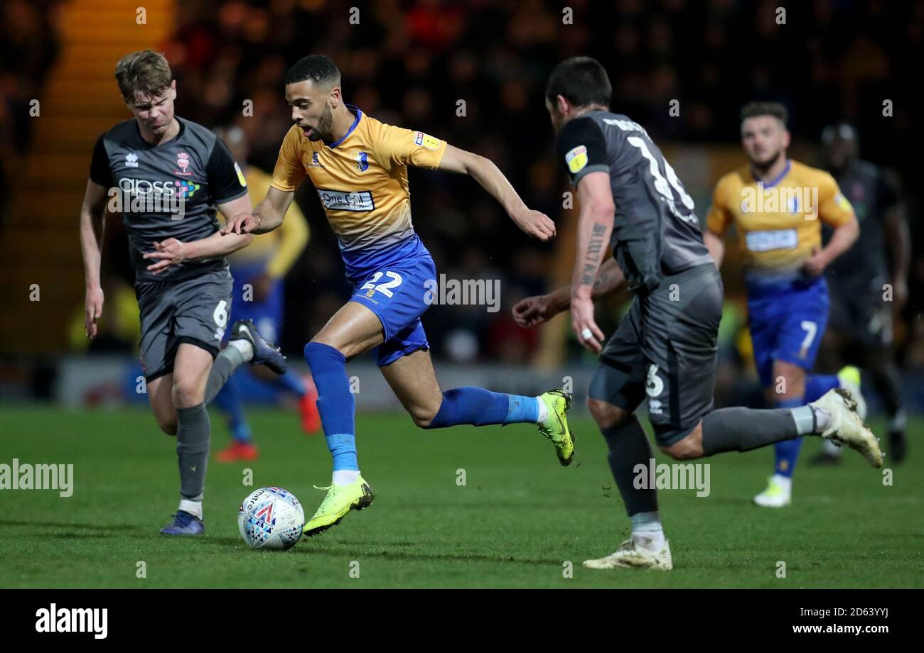 Mansfield Town's CJ Hamilton in action with Lincoln City's Mark O'Hara ...