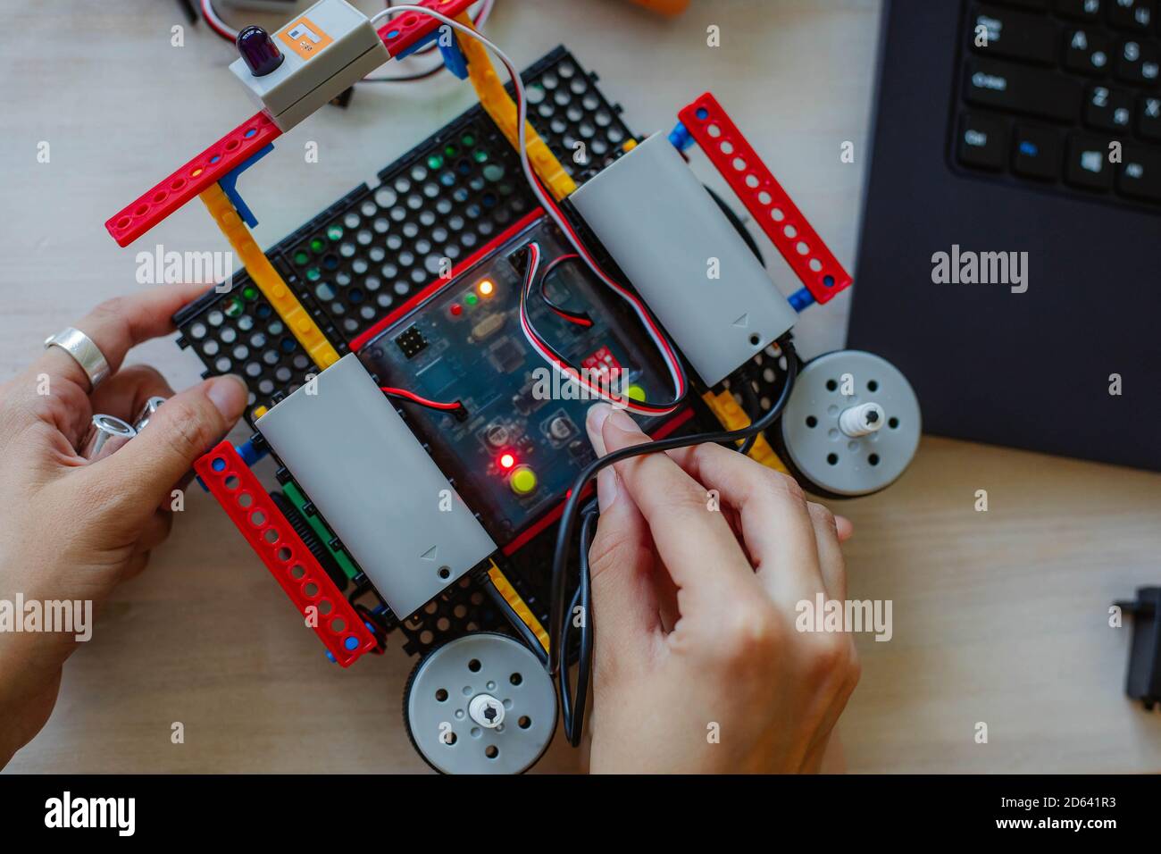 schoolboy study in a robotics class, assemble a robot constructor Stock ...