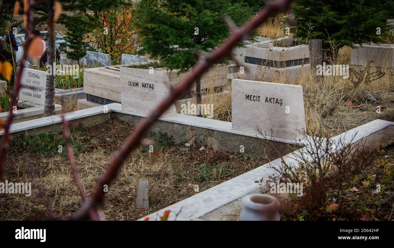 Istanbul, Turkey - October 2012: Muslim cemetery graves beneath a small ...