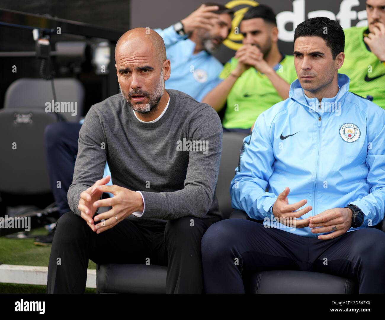Manchester City manager Pep Guardiola (left) with assistant Mikel ...