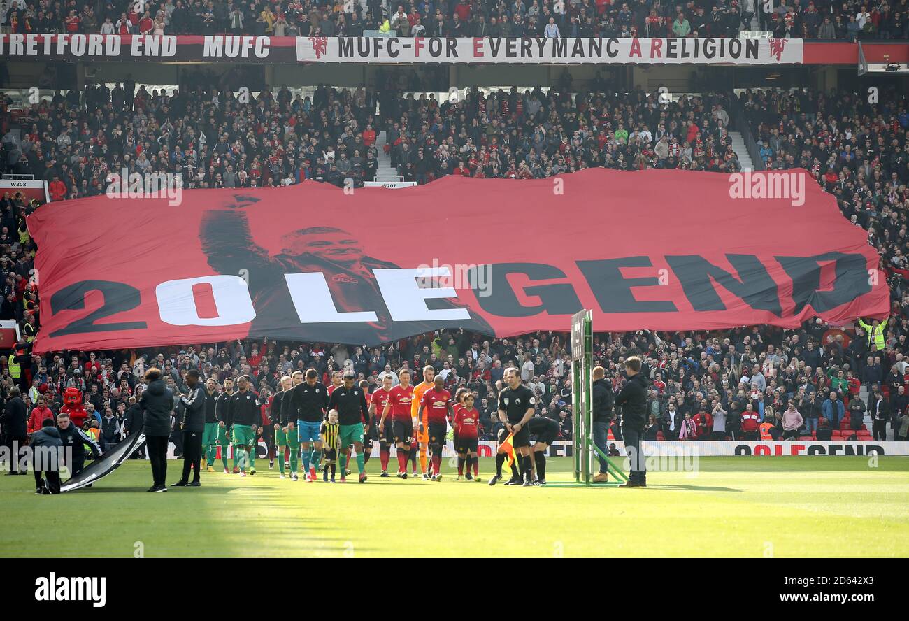 Manchester united fans with a banner in the stands hi-res stock ...