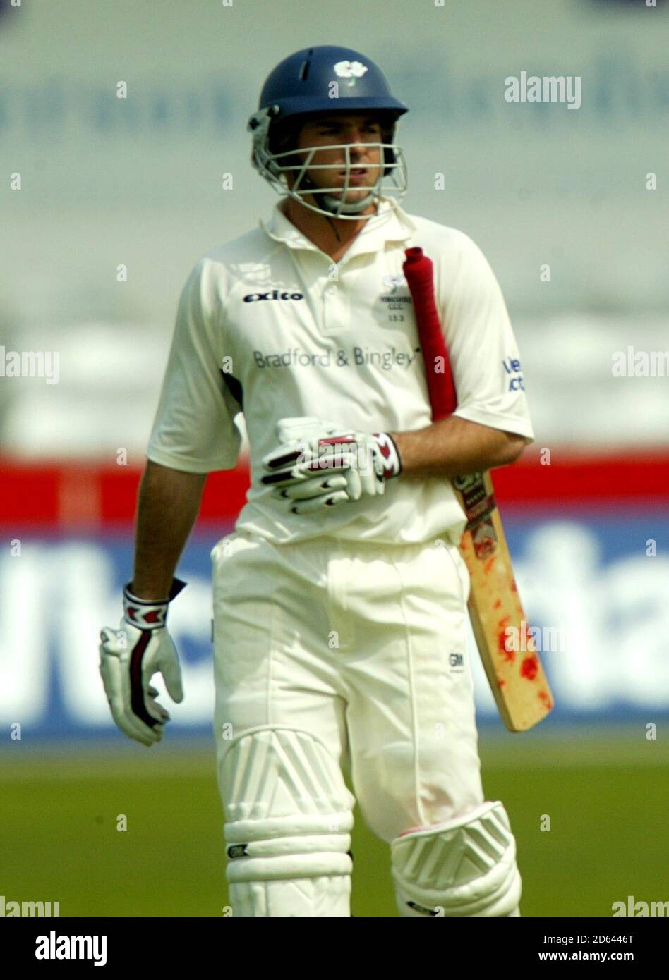 Yorkshire's Michael Lumb walks back to the pavilion after being ...