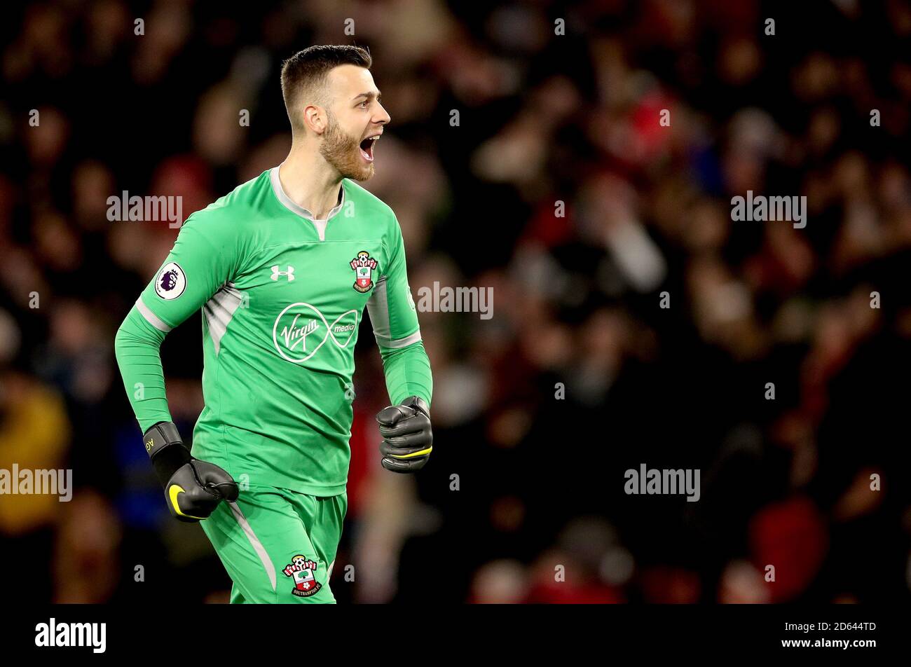 Southampton goalkeeper Angus Gunn celebrates after team-mate Shane Long ...
