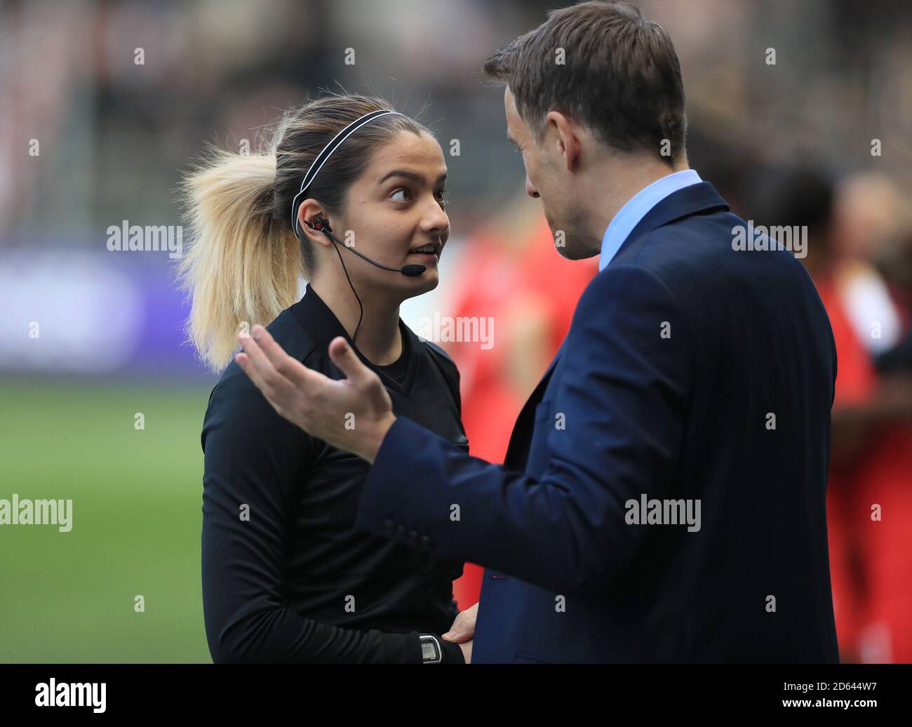 England manager Phil Neville chats with fourth official Yasmin Saeed ...