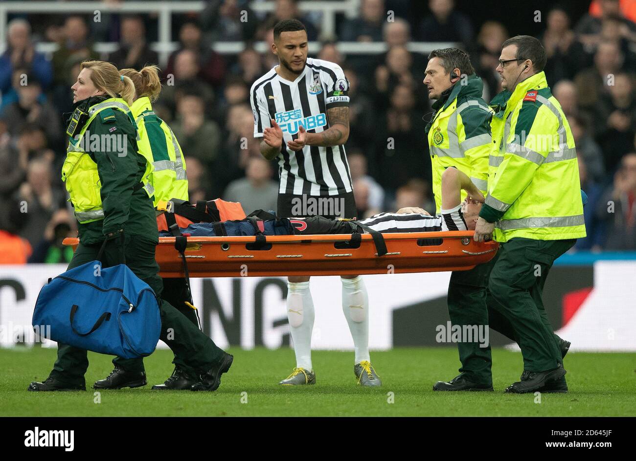 Newcastle United's Florian Lejeune is stretchered off the pitch after ...