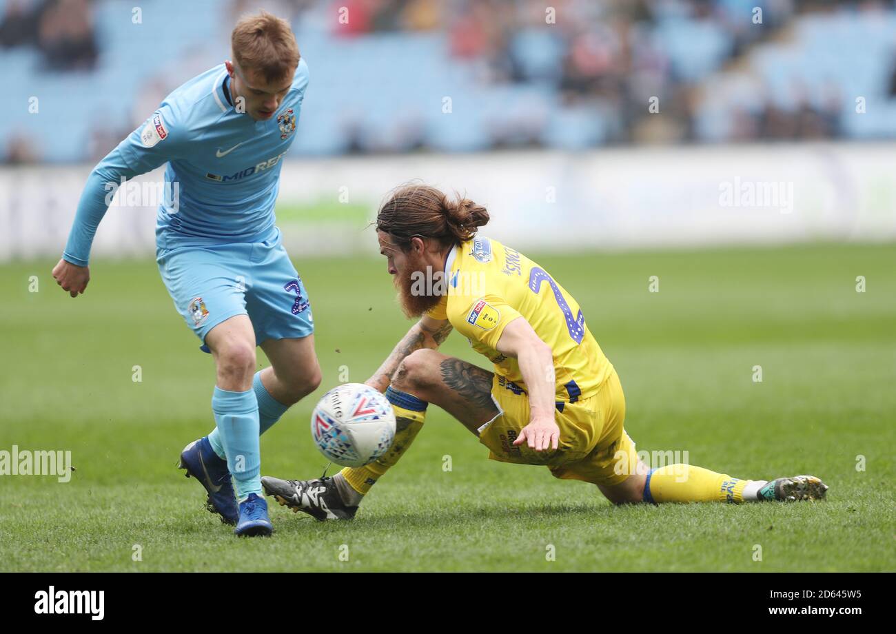 Coventry City's Luke Thomas and Bristol Rovers' Stuart Sinclair battle ...