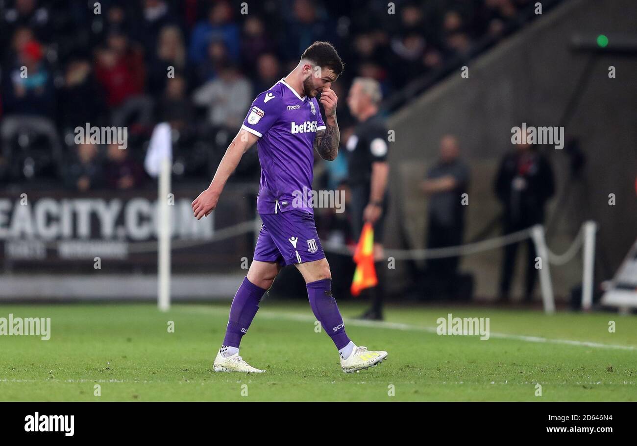Stoke City's Tom Edwards leaves the pitch after being shown a red card ...