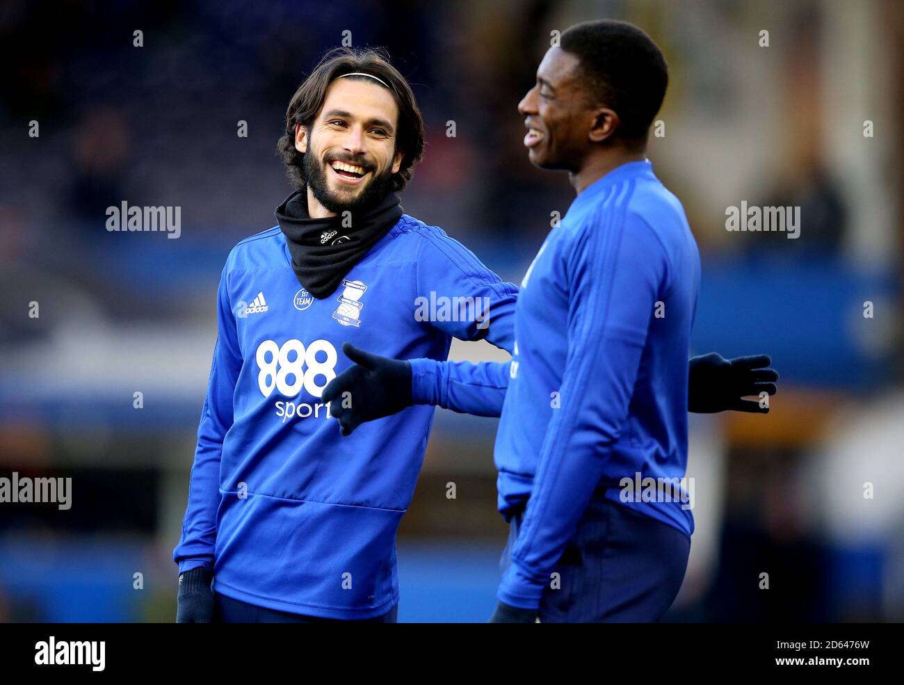 Birmingham City's Jota (left) and Wes Harding warming up on the pitch ...