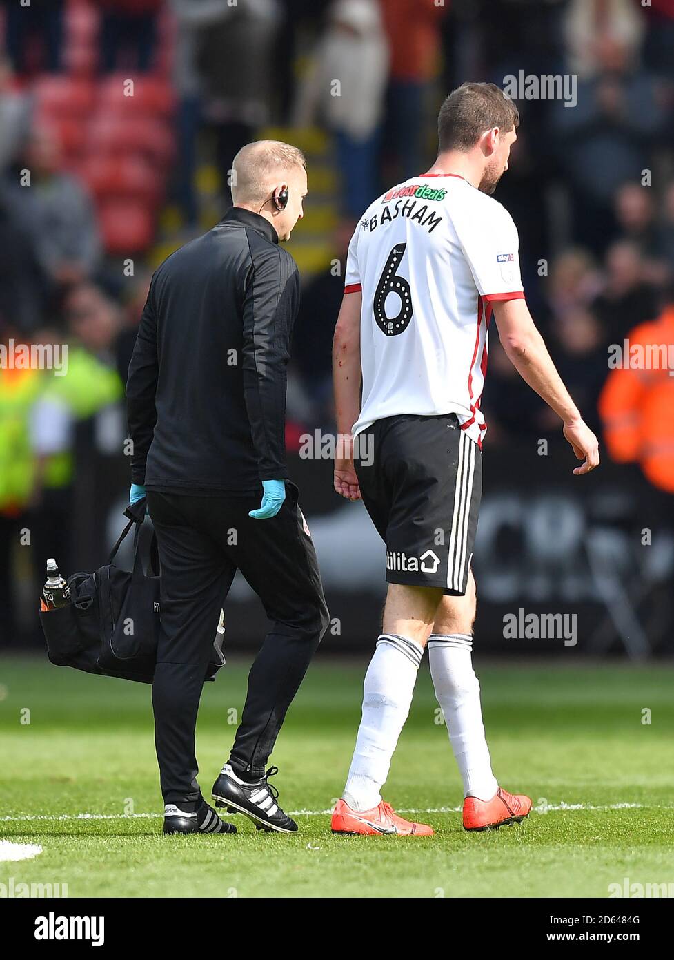 Sheffield United's Chris Basham leaves the pitch with an injury Stock ...