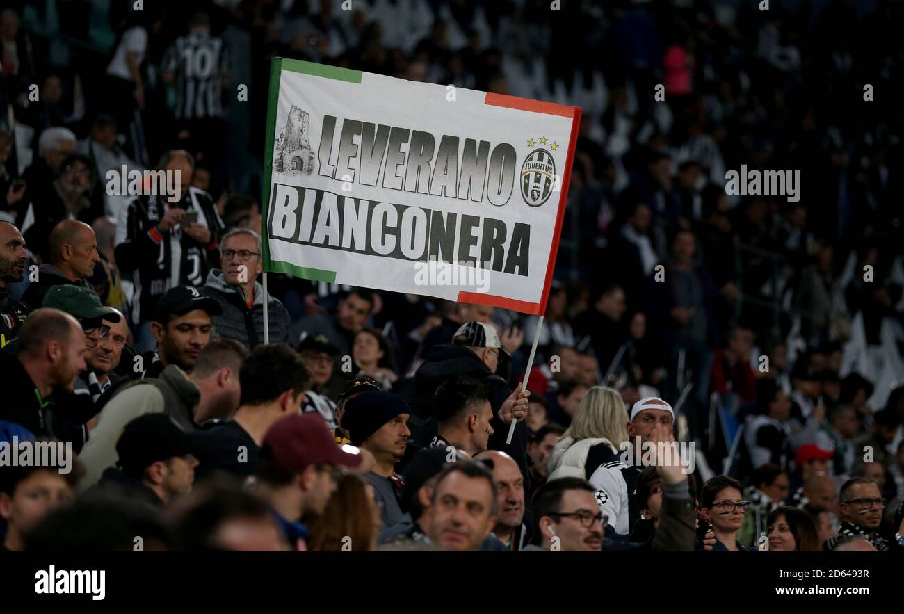 A Juventus sign held up by fans in the stands Stock Photo - Alamy