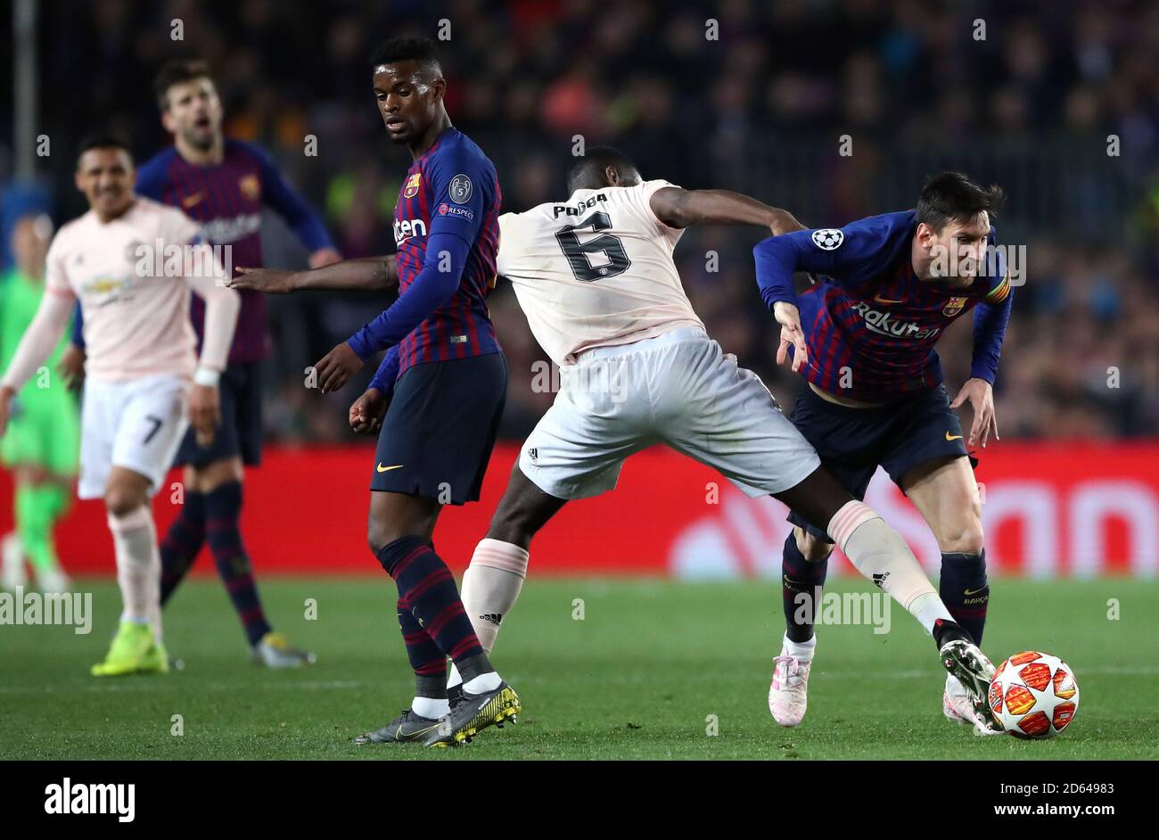 Manchester United's Paul Pogba challenges Barcelona's Lionel Messi ...