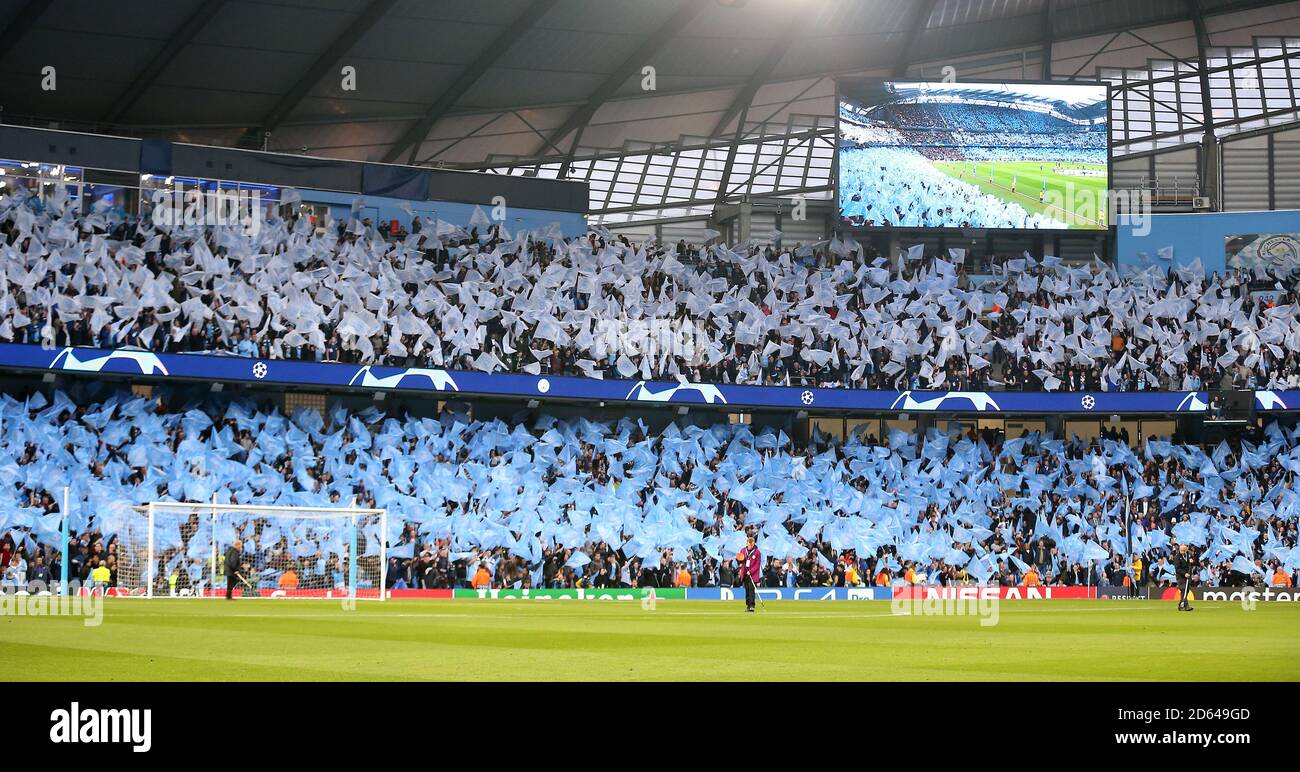 Manchester city fans wave flags hi-res stock photography and images - Alamy