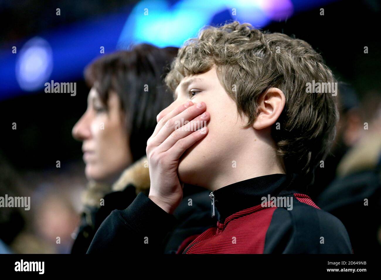 A young Manchester City fan appears dejected Stock Photo - Alamy