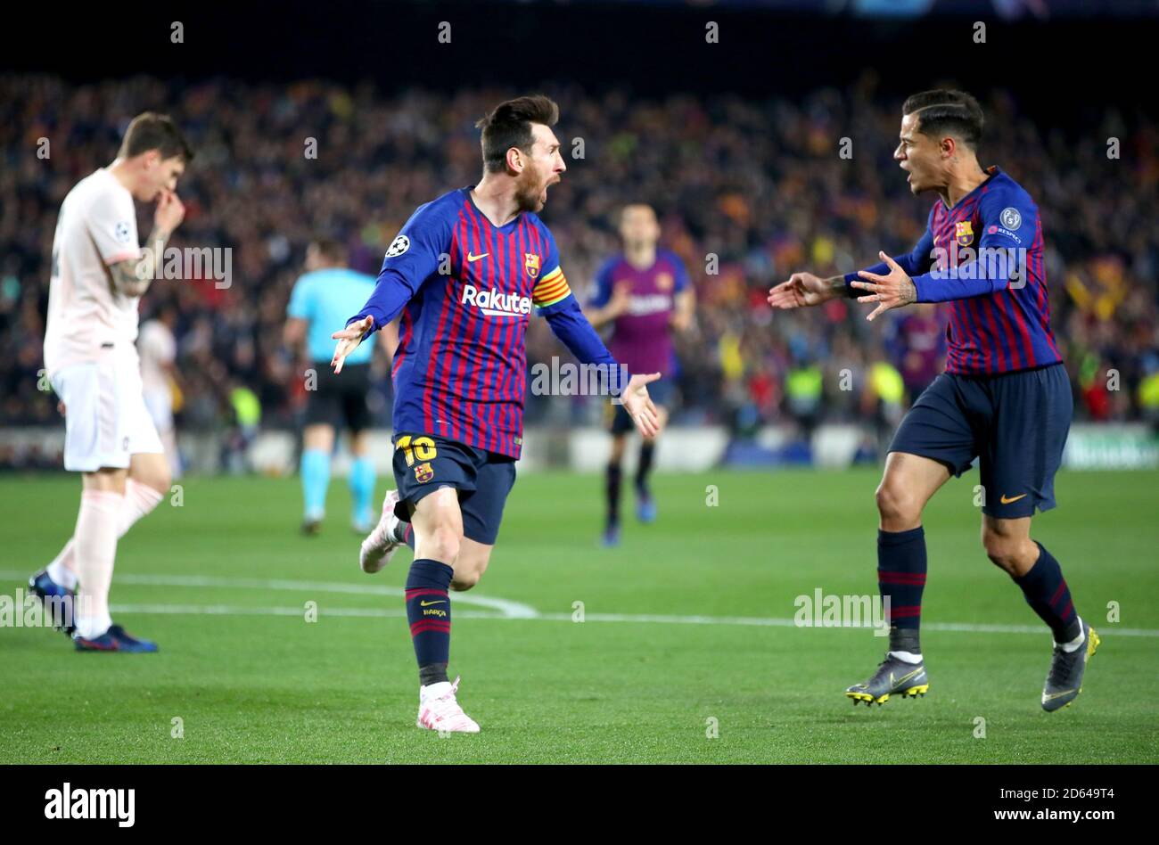 Barcelona's Lionel Messi (centre) celebrates scoring his side's first ...