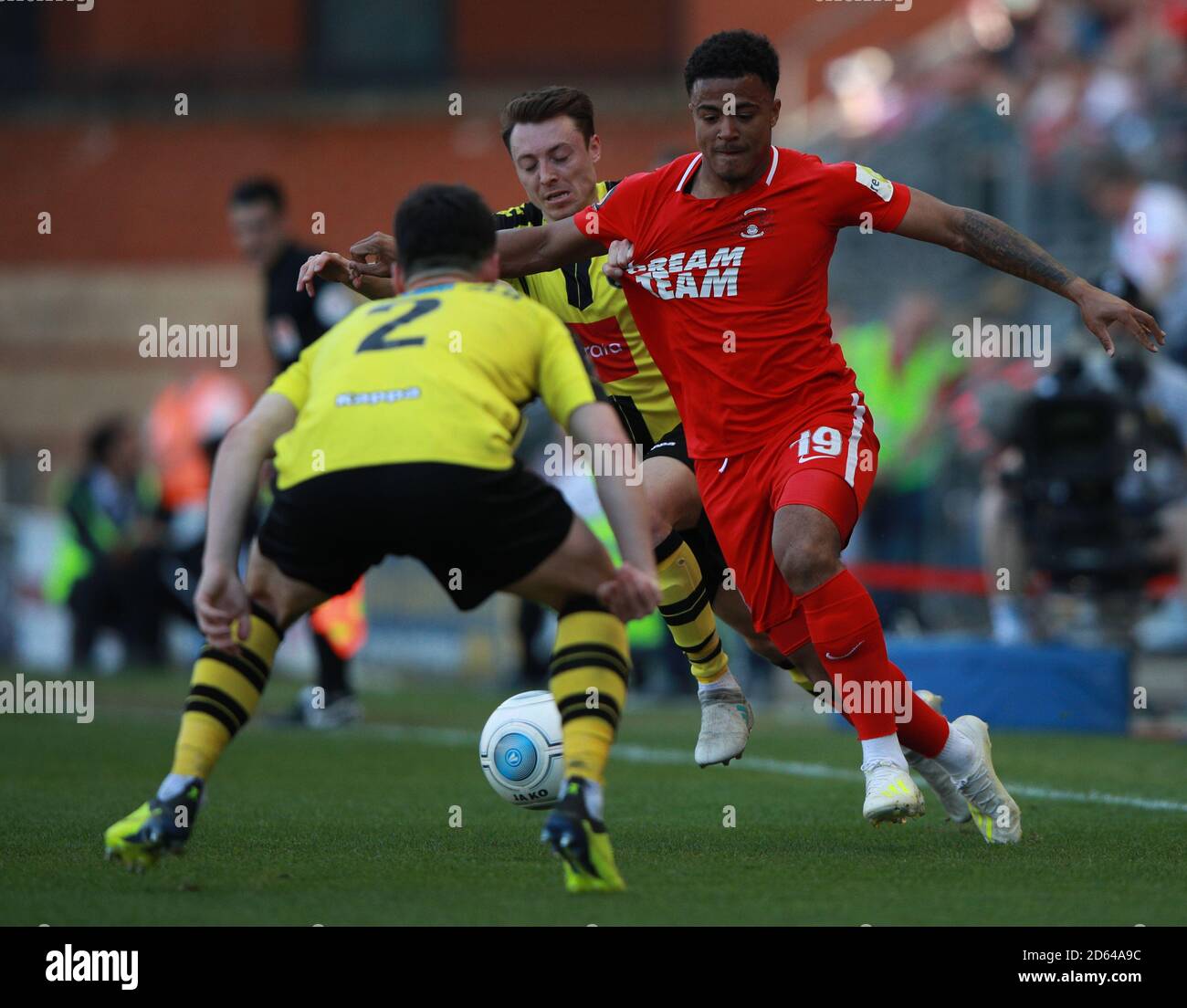 Harrogate Town's Ryan Fallowfield (left) tries to tackle Josh Koroma of ...