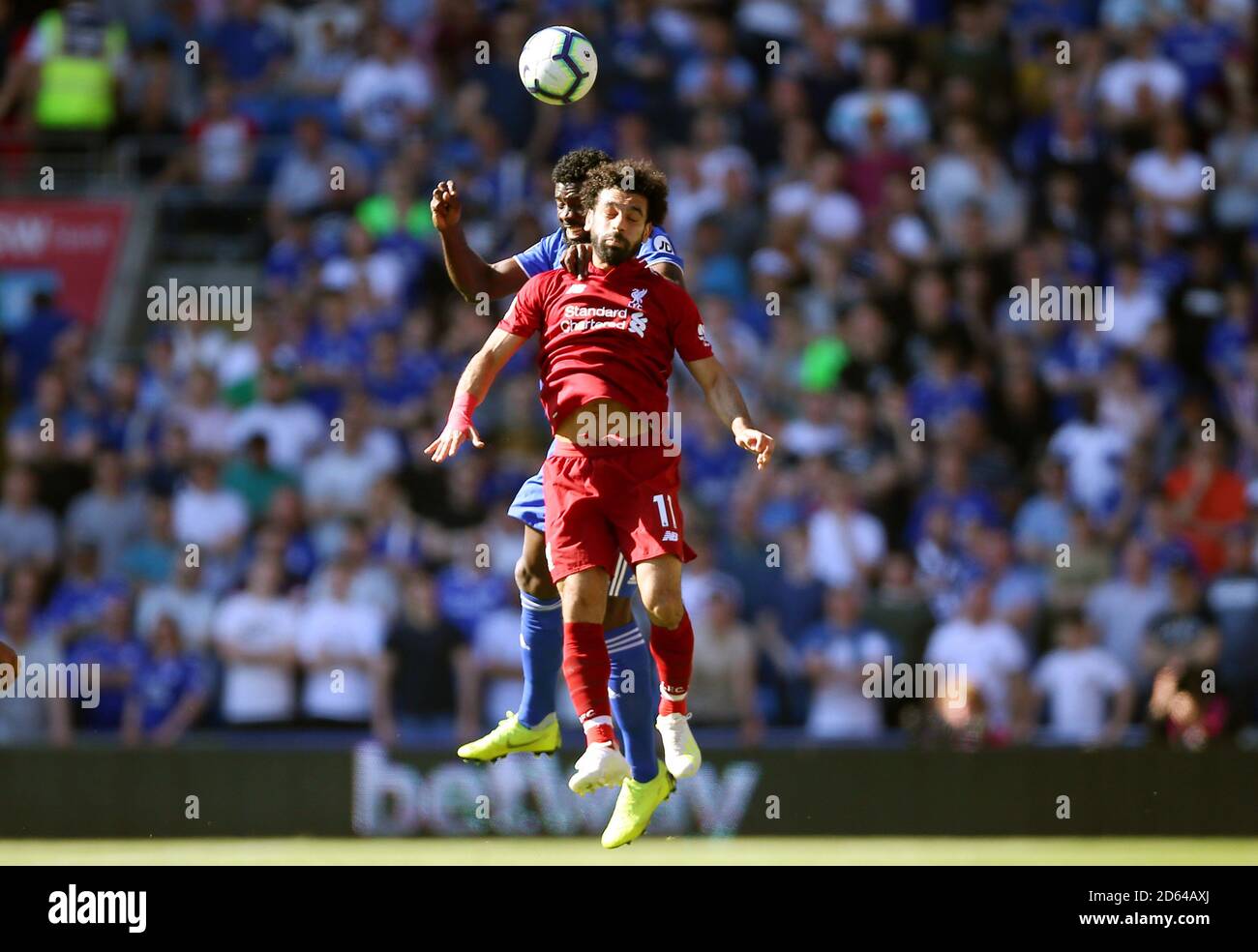 Liverpool's Mohamed Salah jumps for a header Stock Photo - Alamy