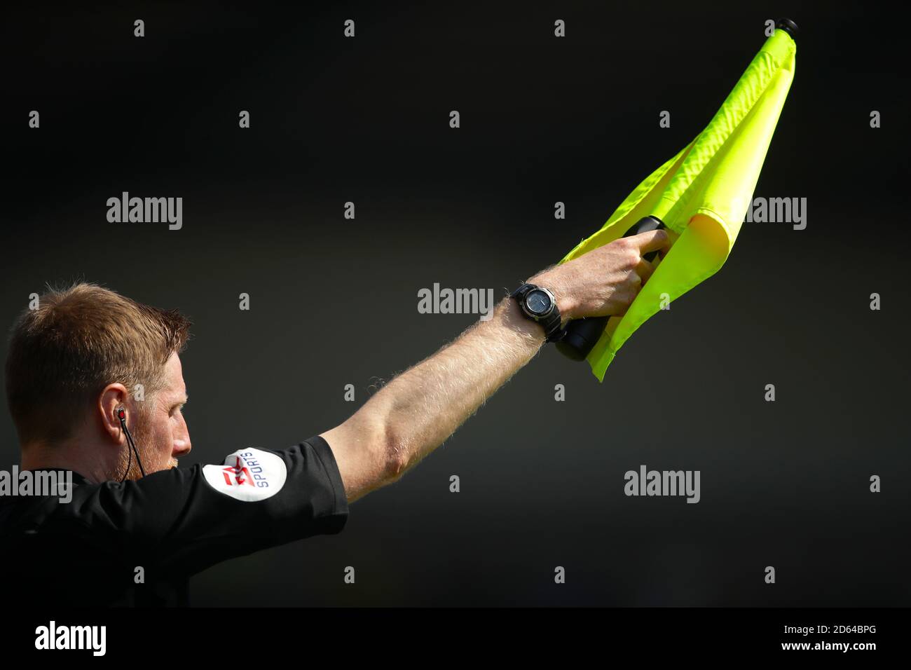 The linesman lifts the yellow flag Stock Photo - Alamy