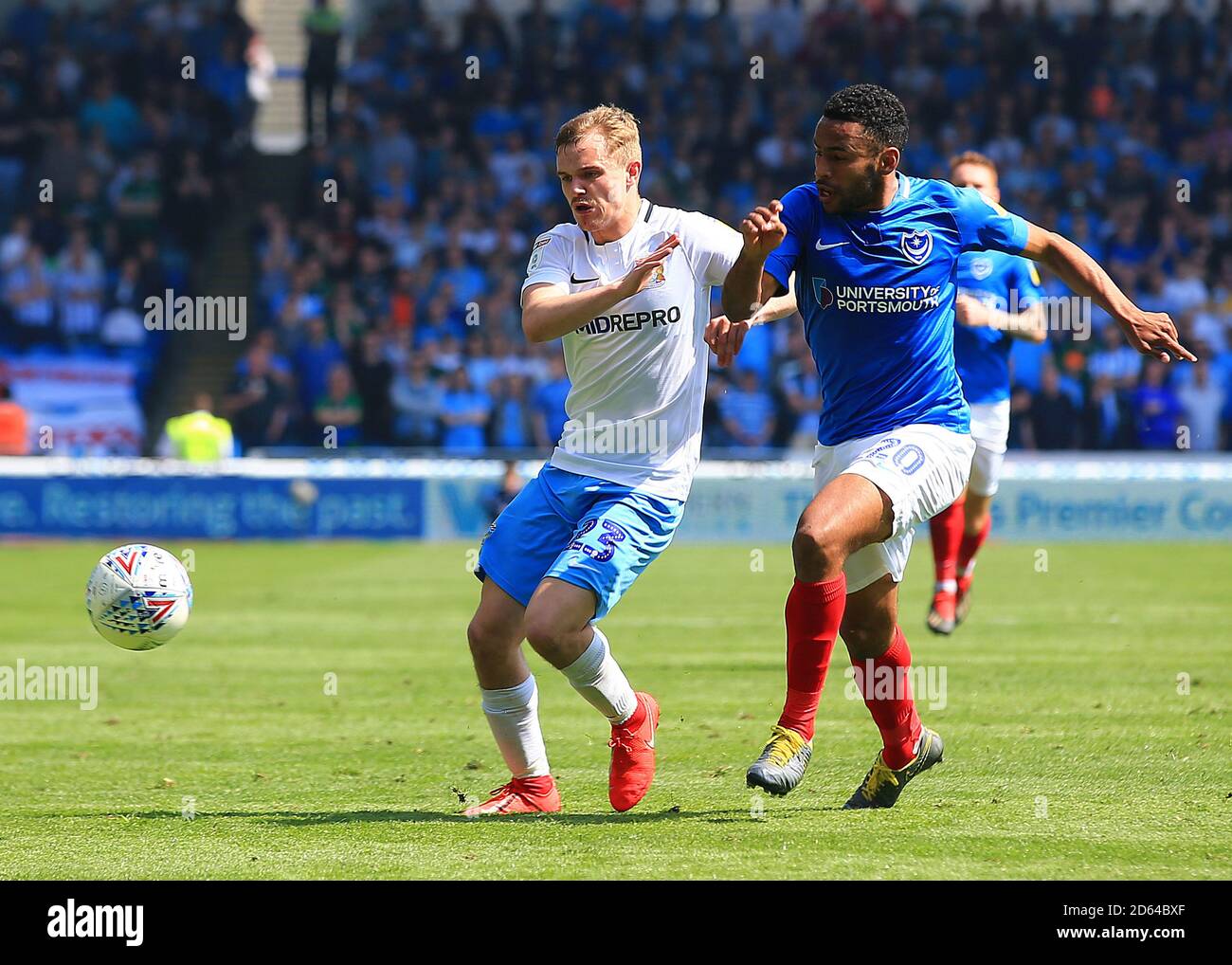Coventry's Luke Thomas and Portsmouth's Nathan Thompson battle for ...