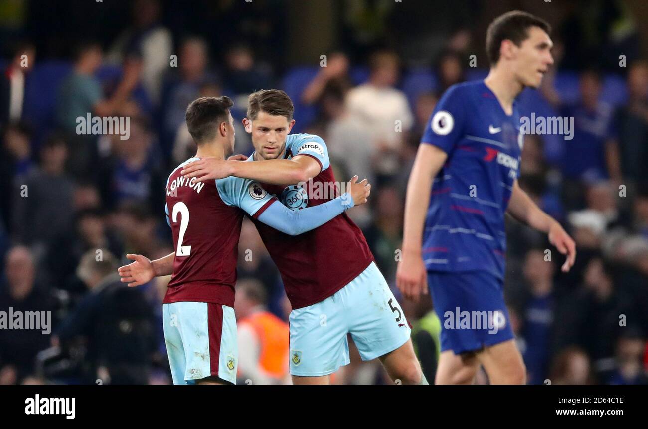 Burnley's Matthew Lowton (left) and Burnley's James Tarkowski embarce ...