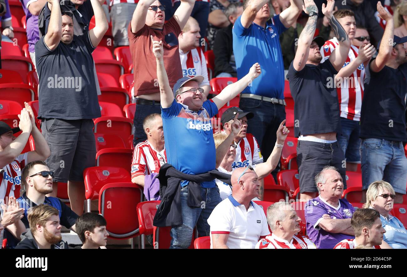 Stoke City fans in the stands Stock Photo - Alamy