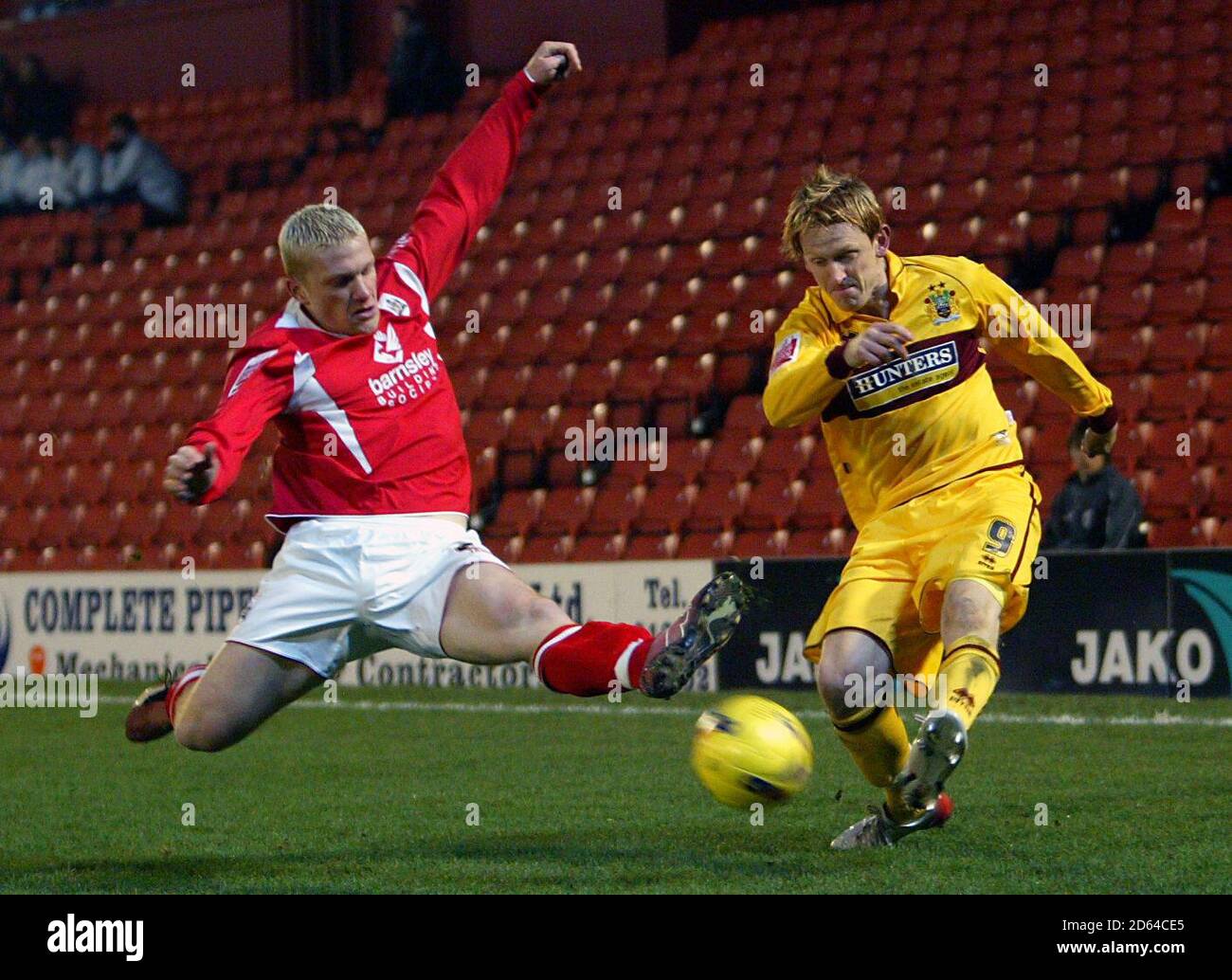 Barnsley's Bobby Hassell and Burnley's Steve Jones Stock Photo - Alamy