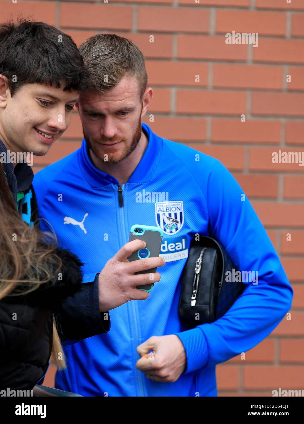 West Bromwich Albion's Chris Brunt poses for a photo with fans prior to ...
