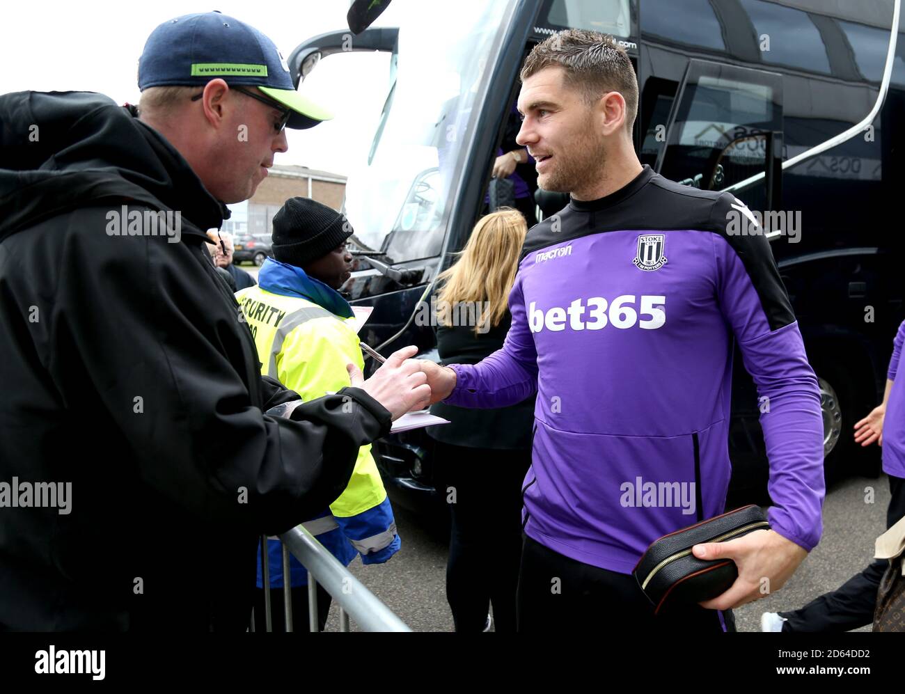 Stoke City's Sam Vokes signs an autograph for a fan as he arrives at ...