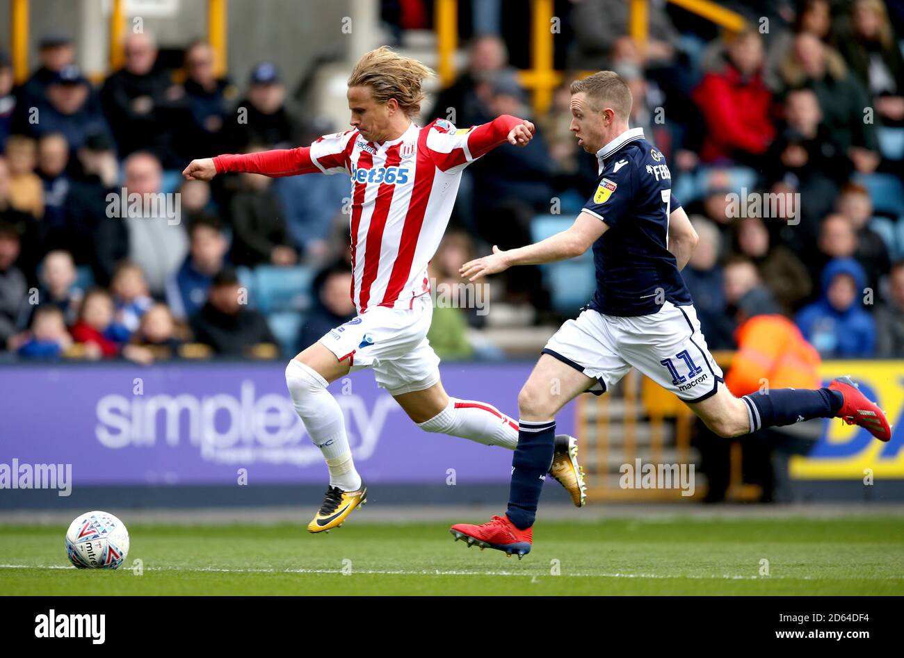 Stoke City's Moritz Bauer (left) and Millwall's Shane Ferguson battle ...